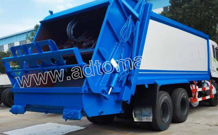 Waste management garbage compactor truck